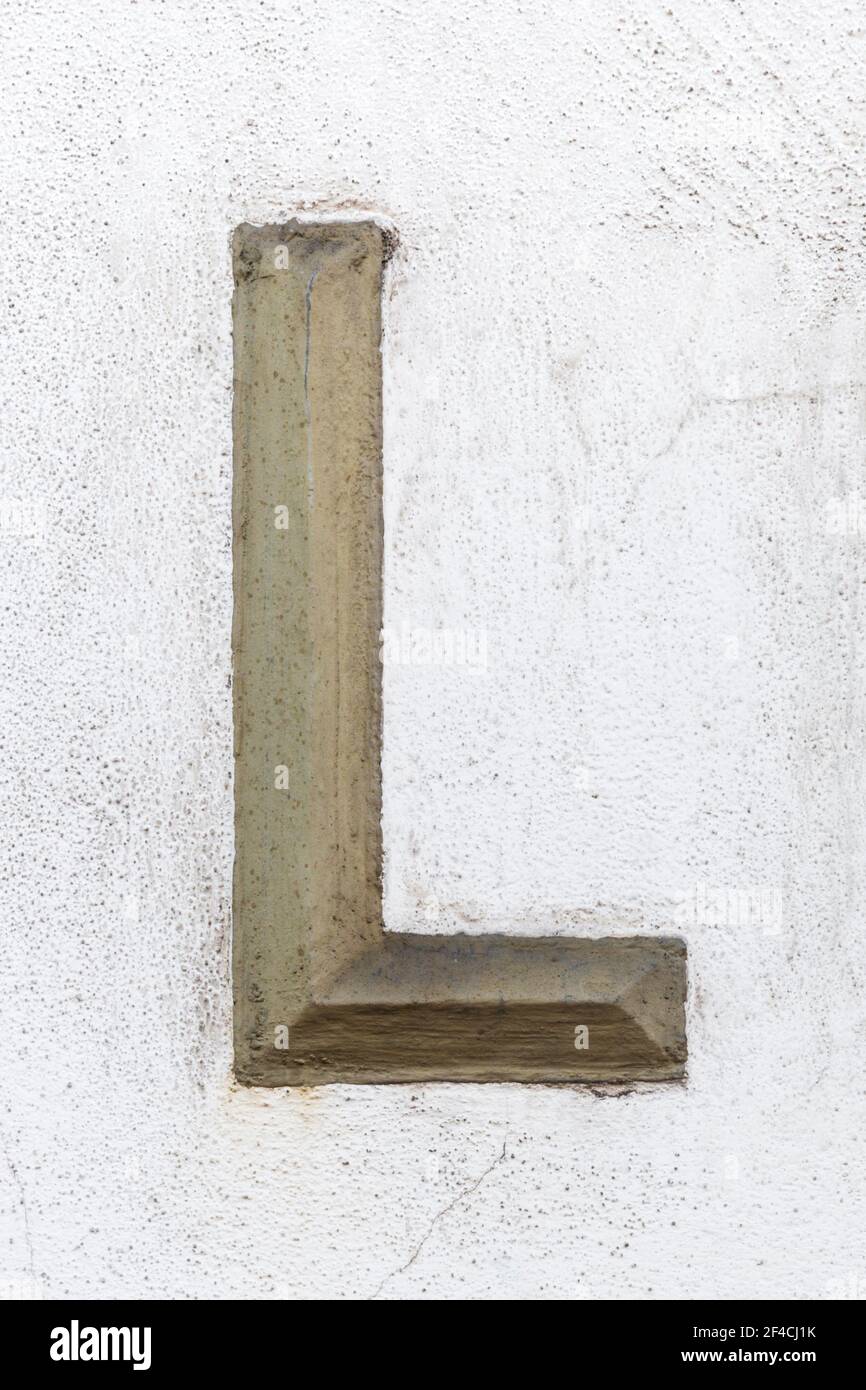 Olive green stucco capital letter L Stock Photo - Alamy
