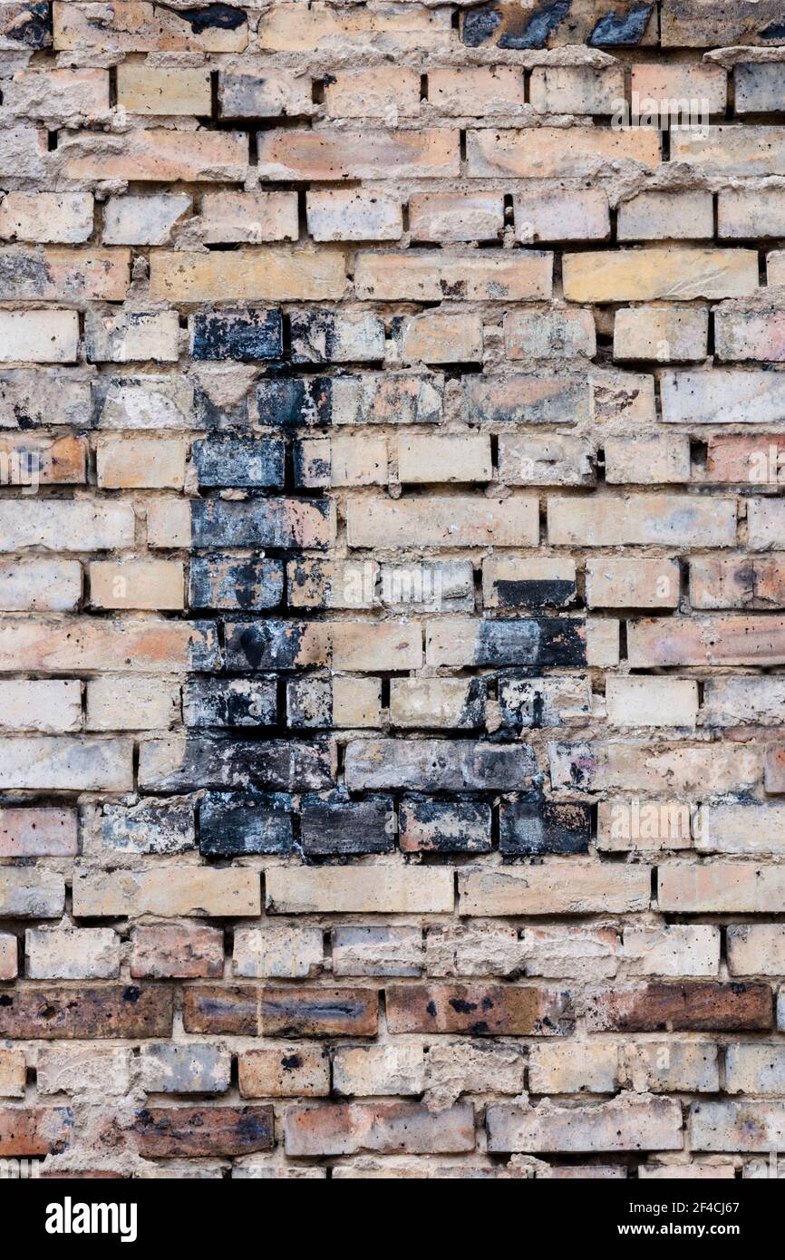 Heavily weathered letter L painted on a brick wall Stock Photo - Alamy
