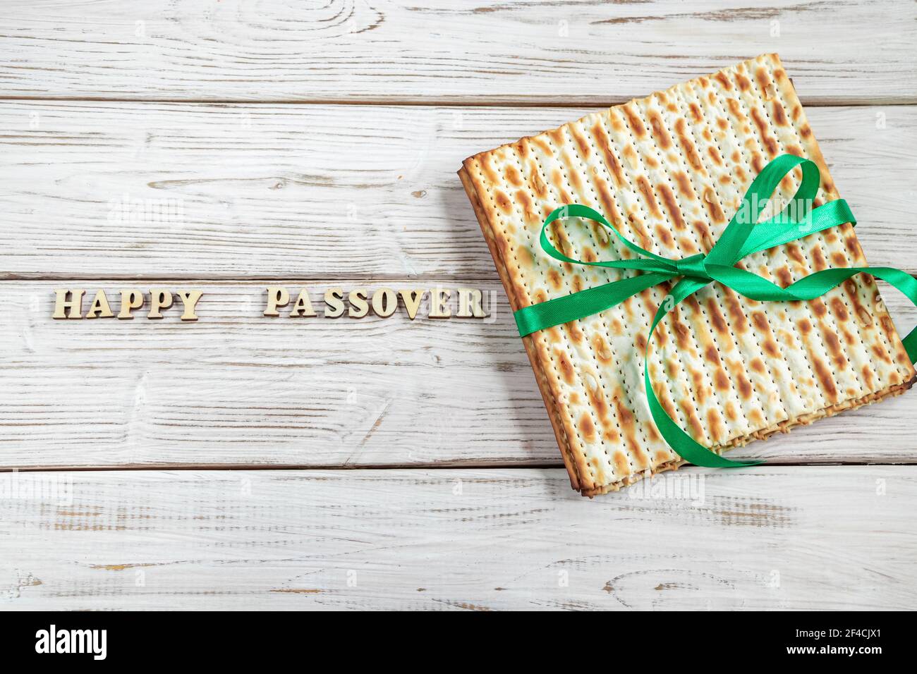 Happy Passover. Matzah on white wooden background. Traditional Jewish ...