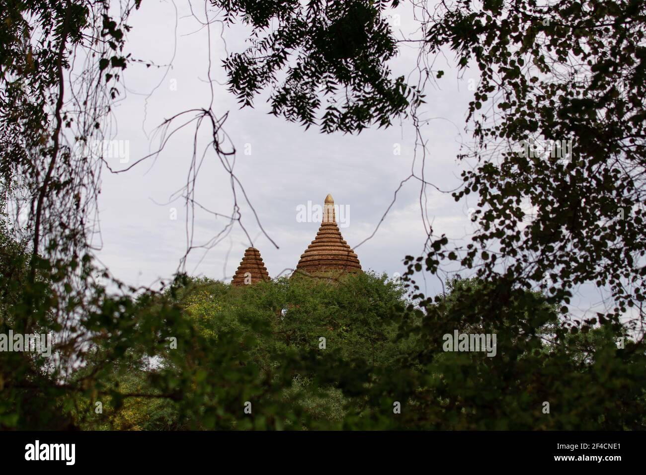 BAGAN, NYAUNG-U, MYANMAR - 3 JANUARY 2020: The top of two spires of an ...