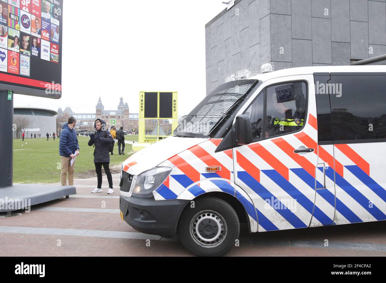 Amsterdam, Netherlands. 20th Mar, 2021. Dutch riot police patrol after ...
