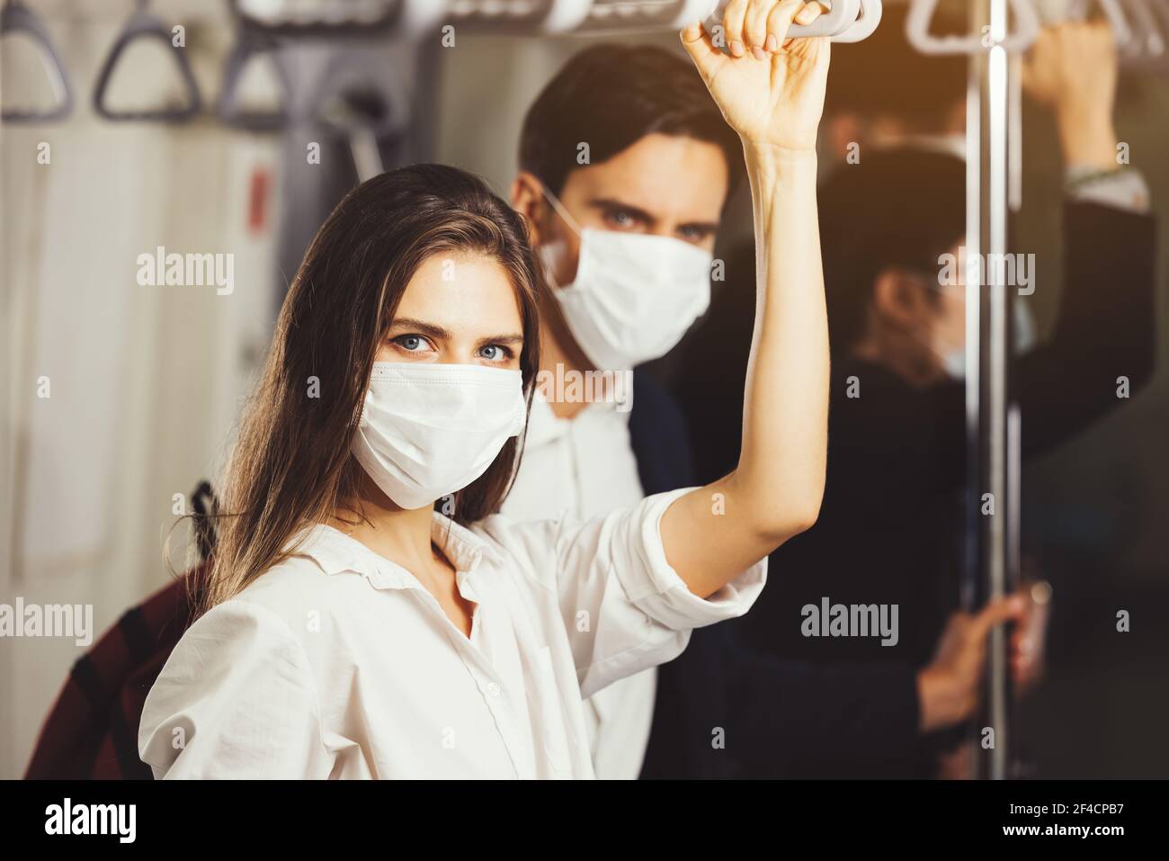 People on the train wear anti-virus masks and travel during rush hours ...