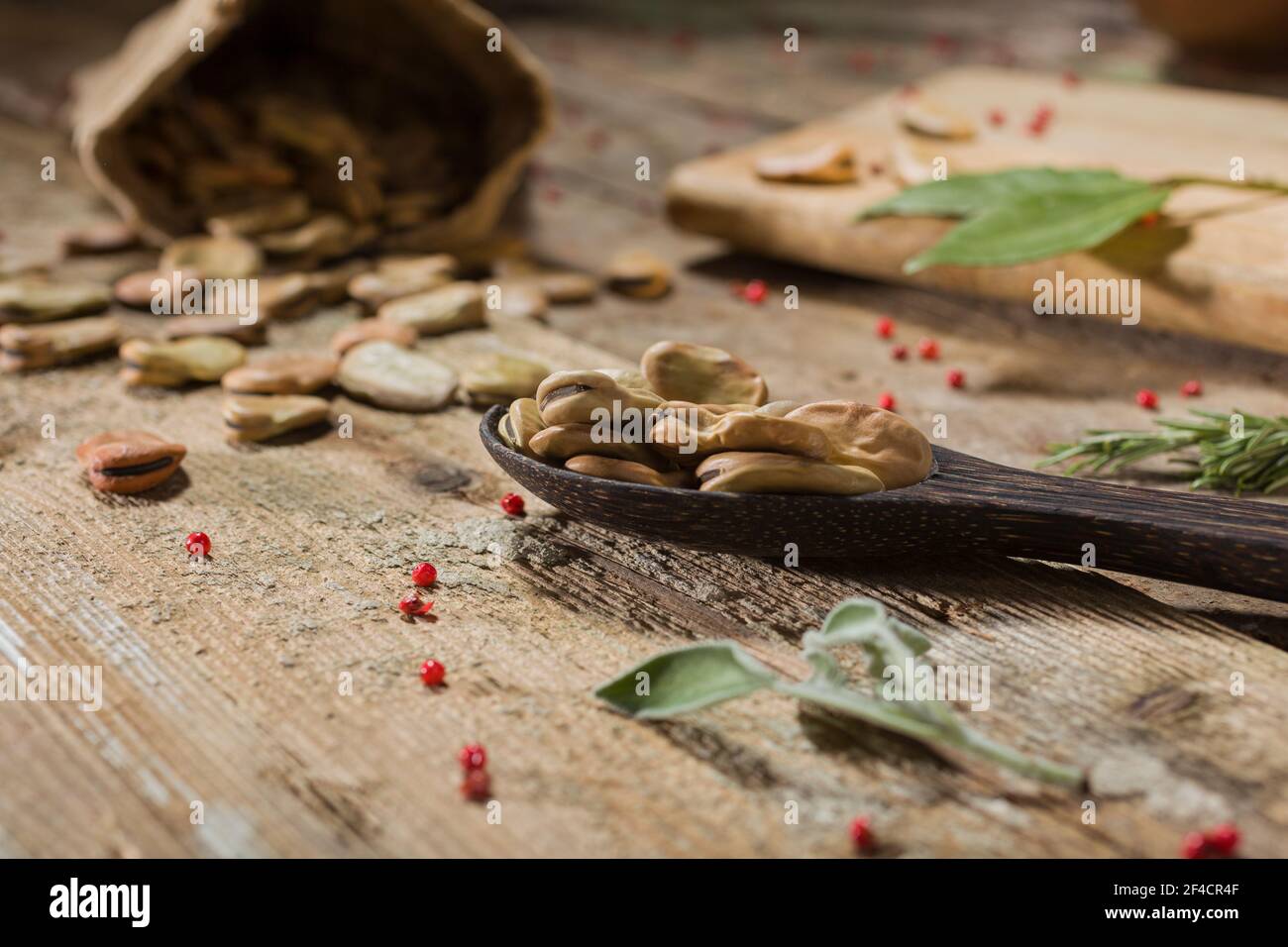 Close up of dried broad beans in the wooden ladle Stock Photo - Alamy