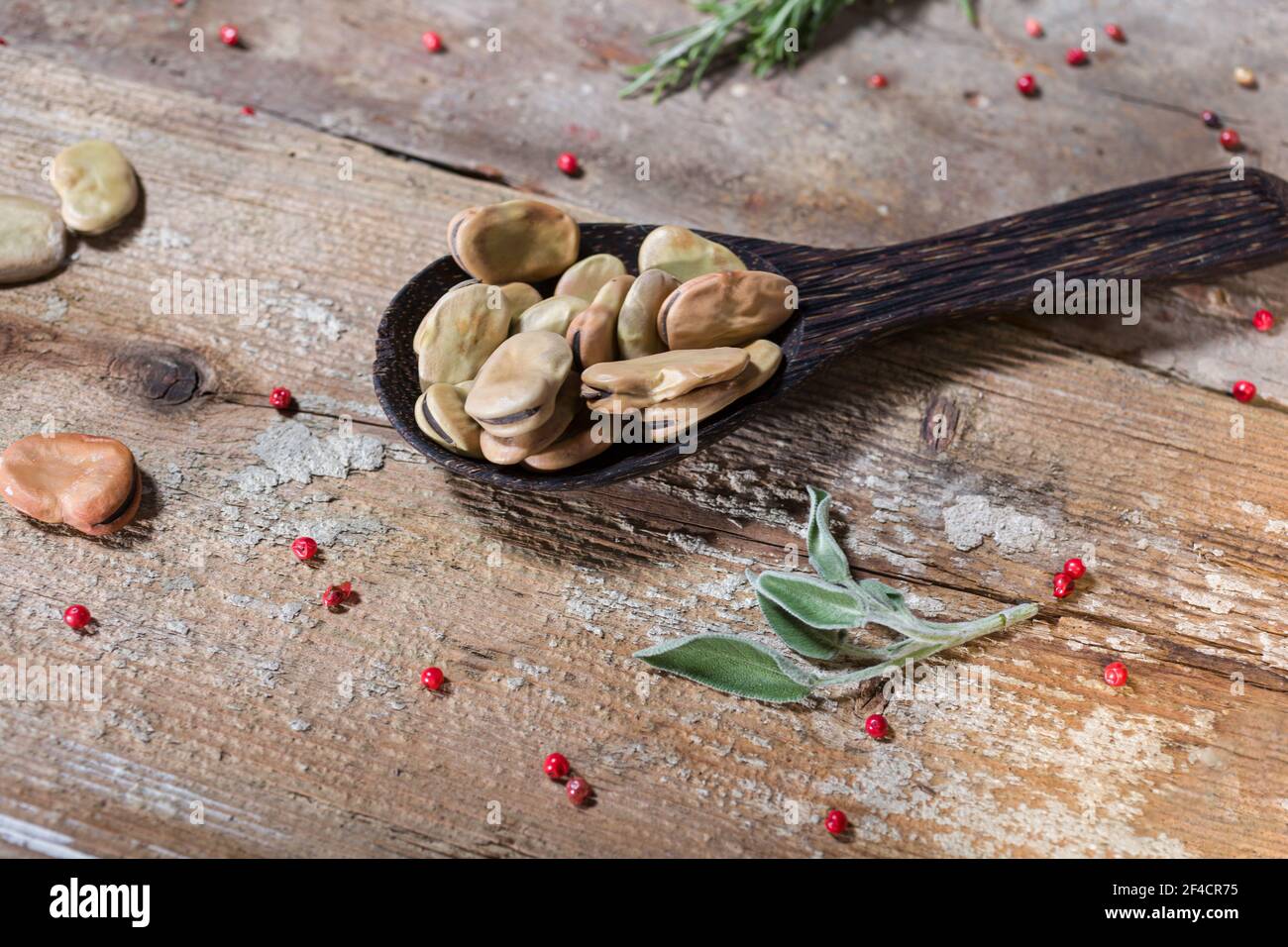 Close up of dried broad beans in the wooden ladle Stock Photo - Alamy