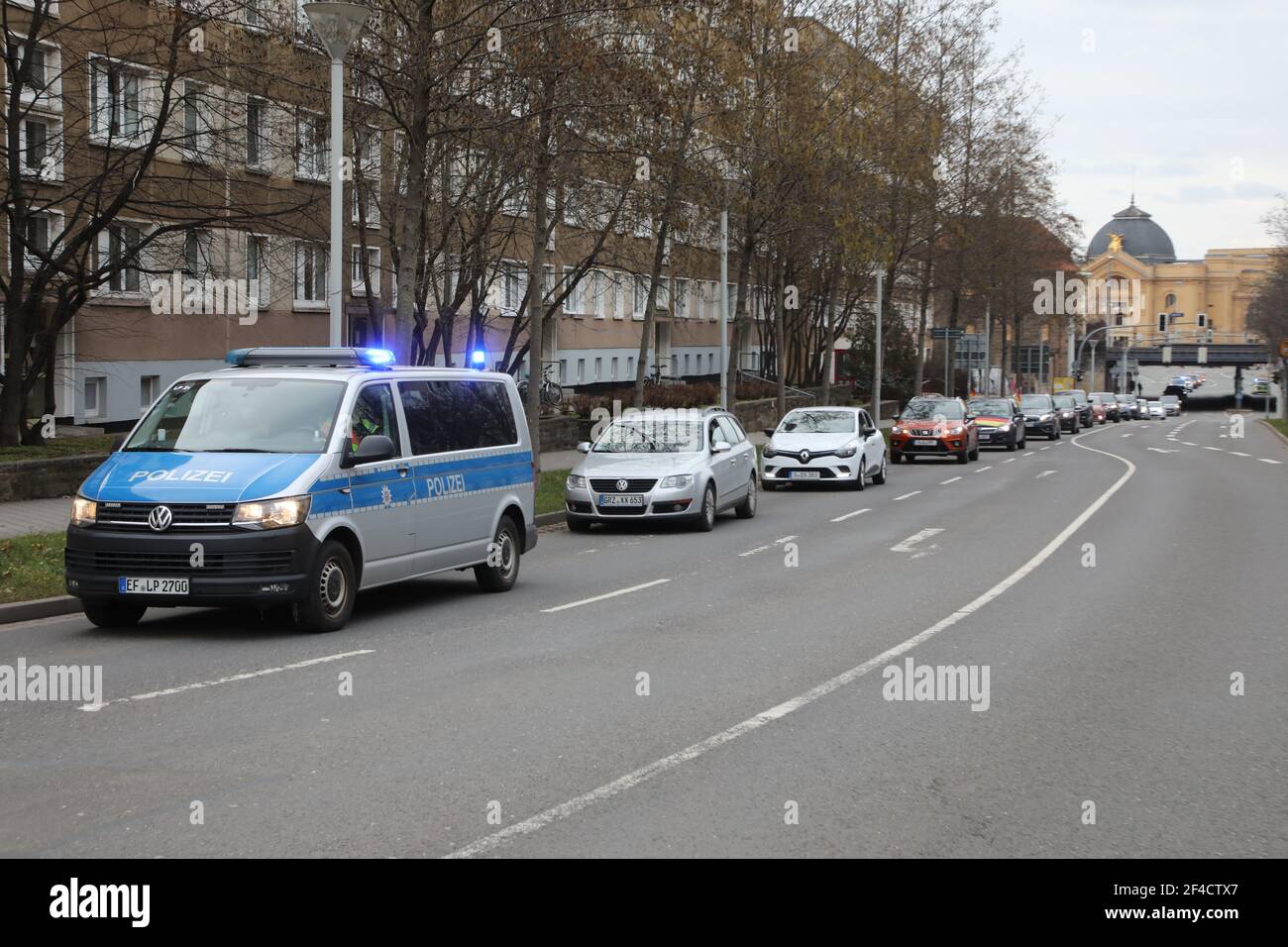 Gera, Germany. 20th Mar, 2021. Accompanied by police vehicles ...