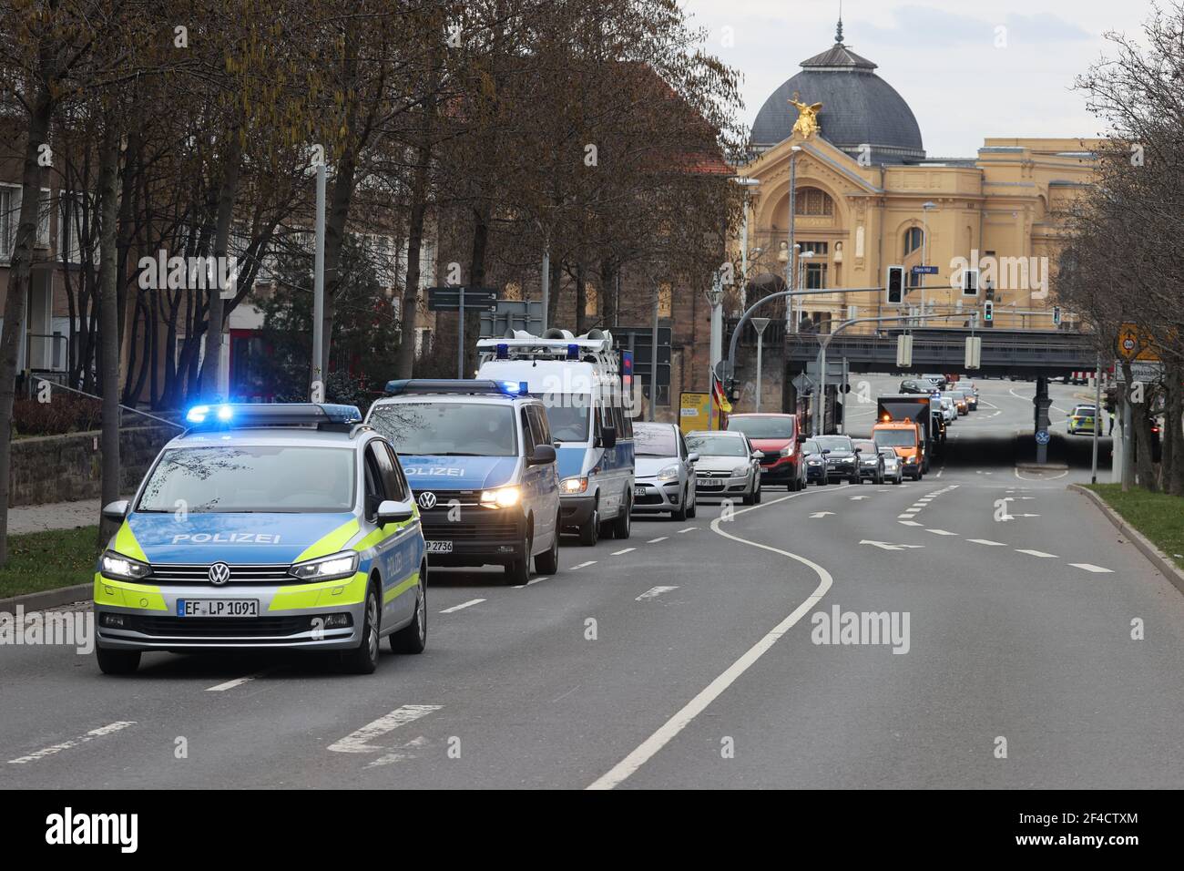 Gera, Germany. 20th Mar, 2021. Accompanied by police vehicles ...