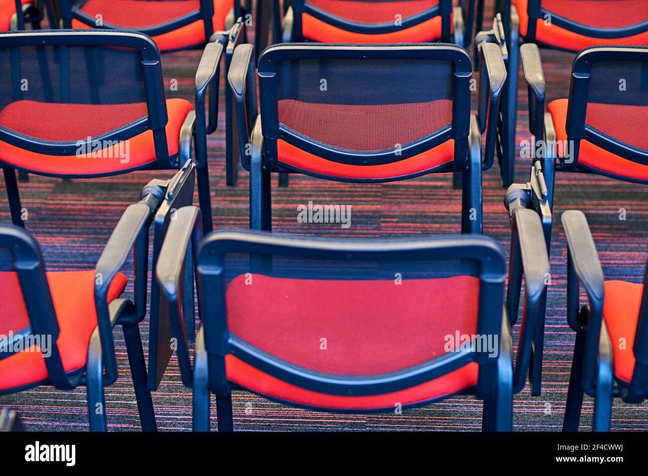 Red and black conference chairs in the auditorium Stock Photo - Alamy