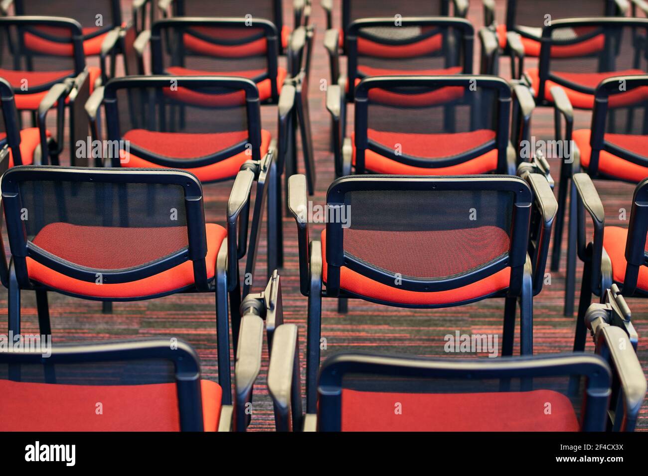 Red and black conference chairs in the auditorium Stock Photo - Alamy