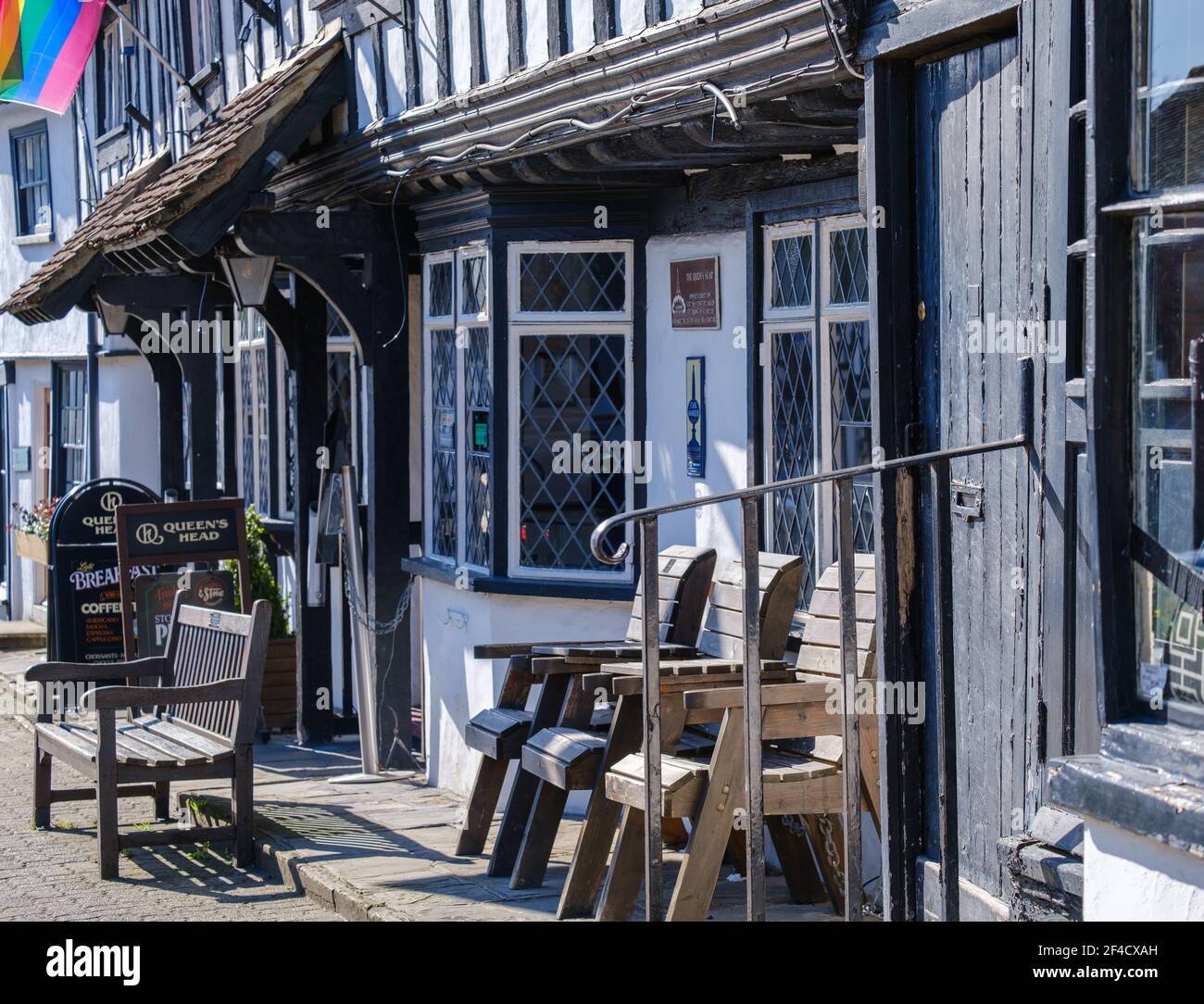 Empty wooden chairs outside Historic Queen’s Head Pub, Pinner High ...