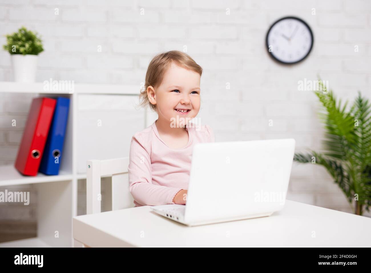 childhood, education, business and technology concept - cheerful cute ...