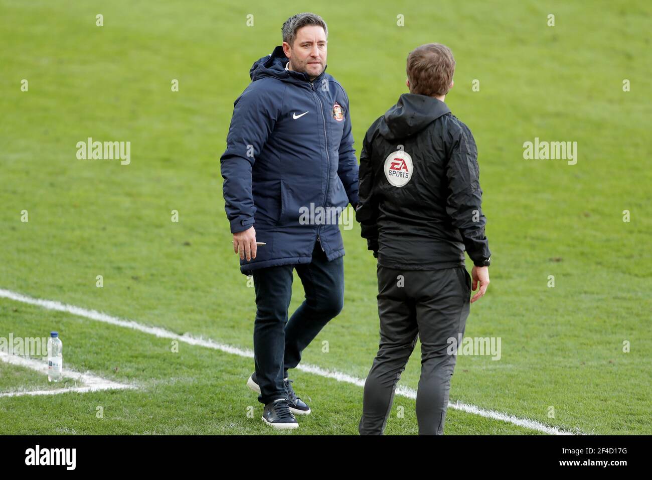 Sunderland manager Lee Johnson has a word with the 4th official during ...