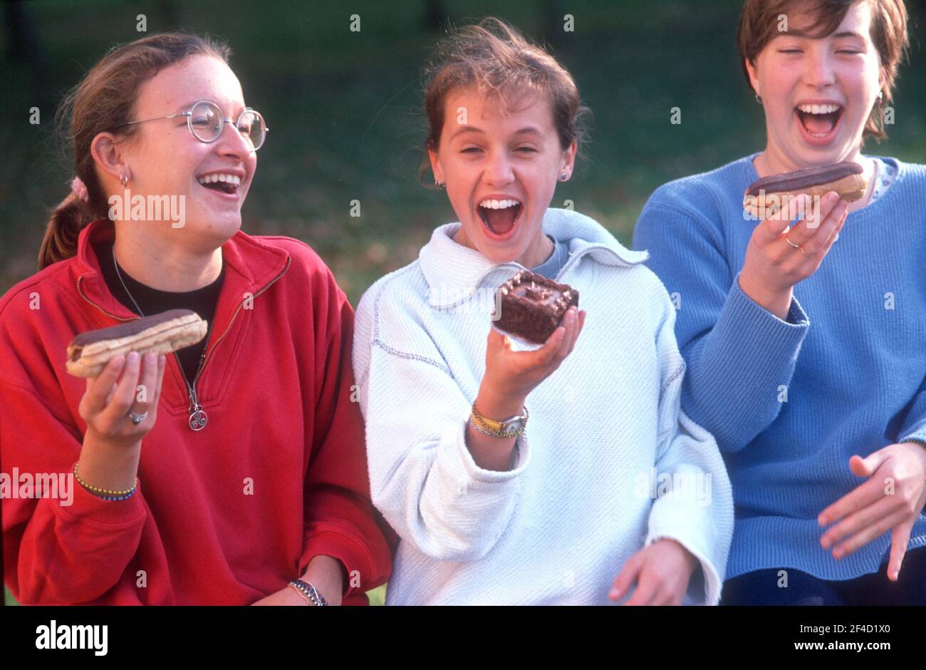 Girl eating cake Stock Photo - Alamy