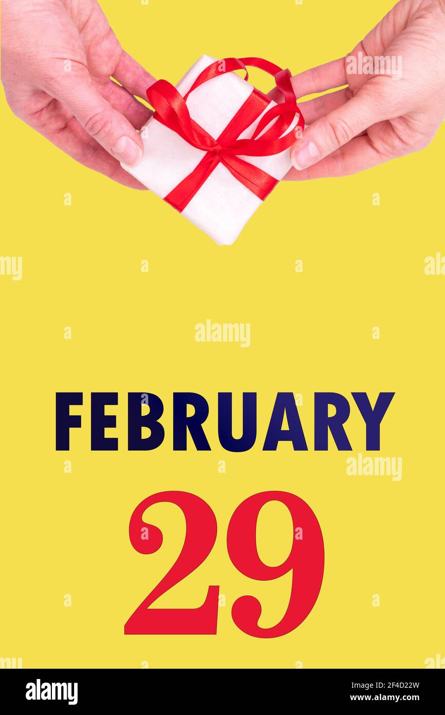 February 29th. Festive Vertical Calendar With Hands Holding White Gift ...
