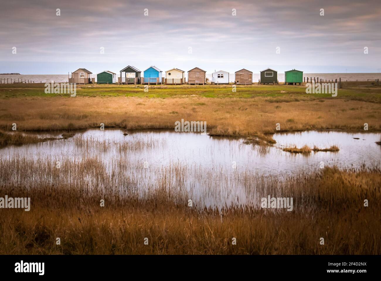 Beach huts at Seasalter beach at sunrise Stock Photo - Alamy