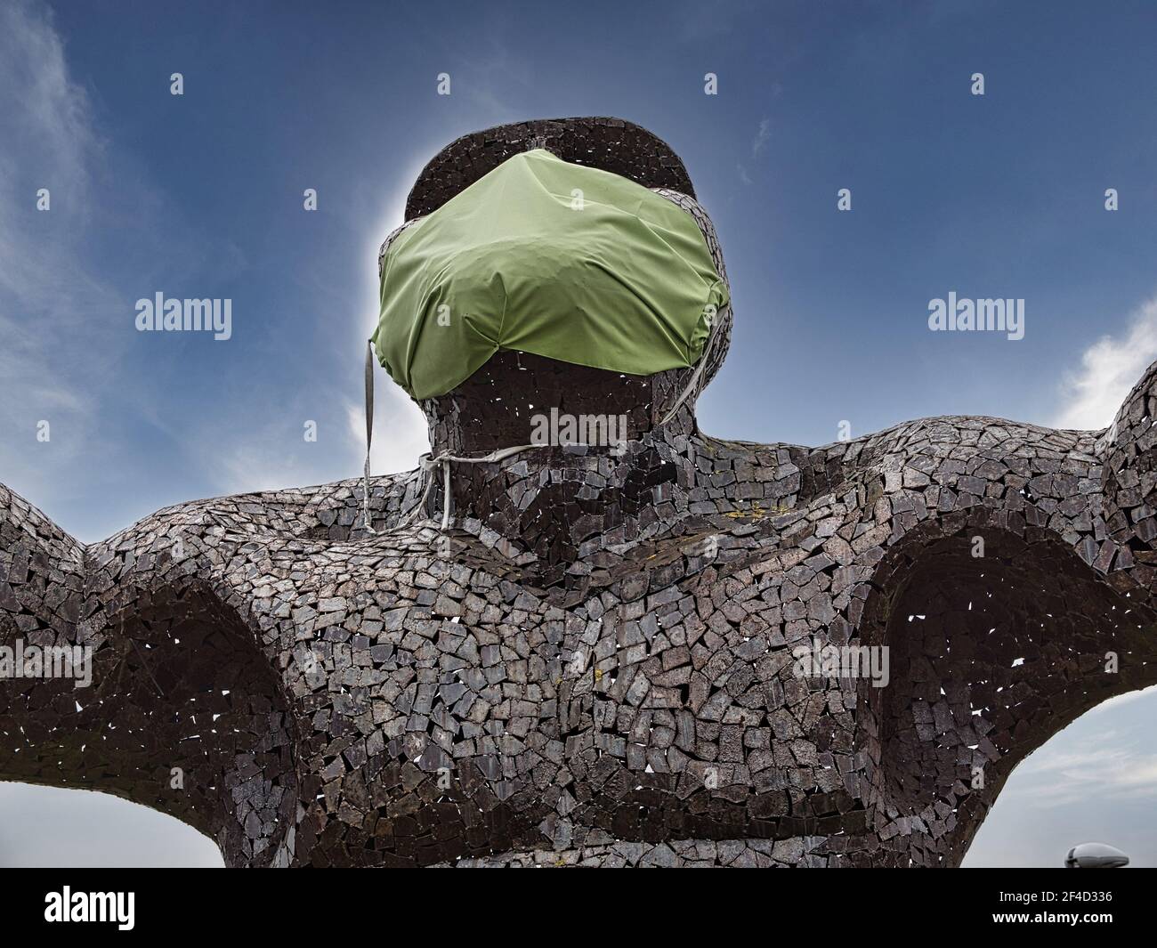 Giant metal figure wearing PPE at Amesbury Stock Photo - Alamy