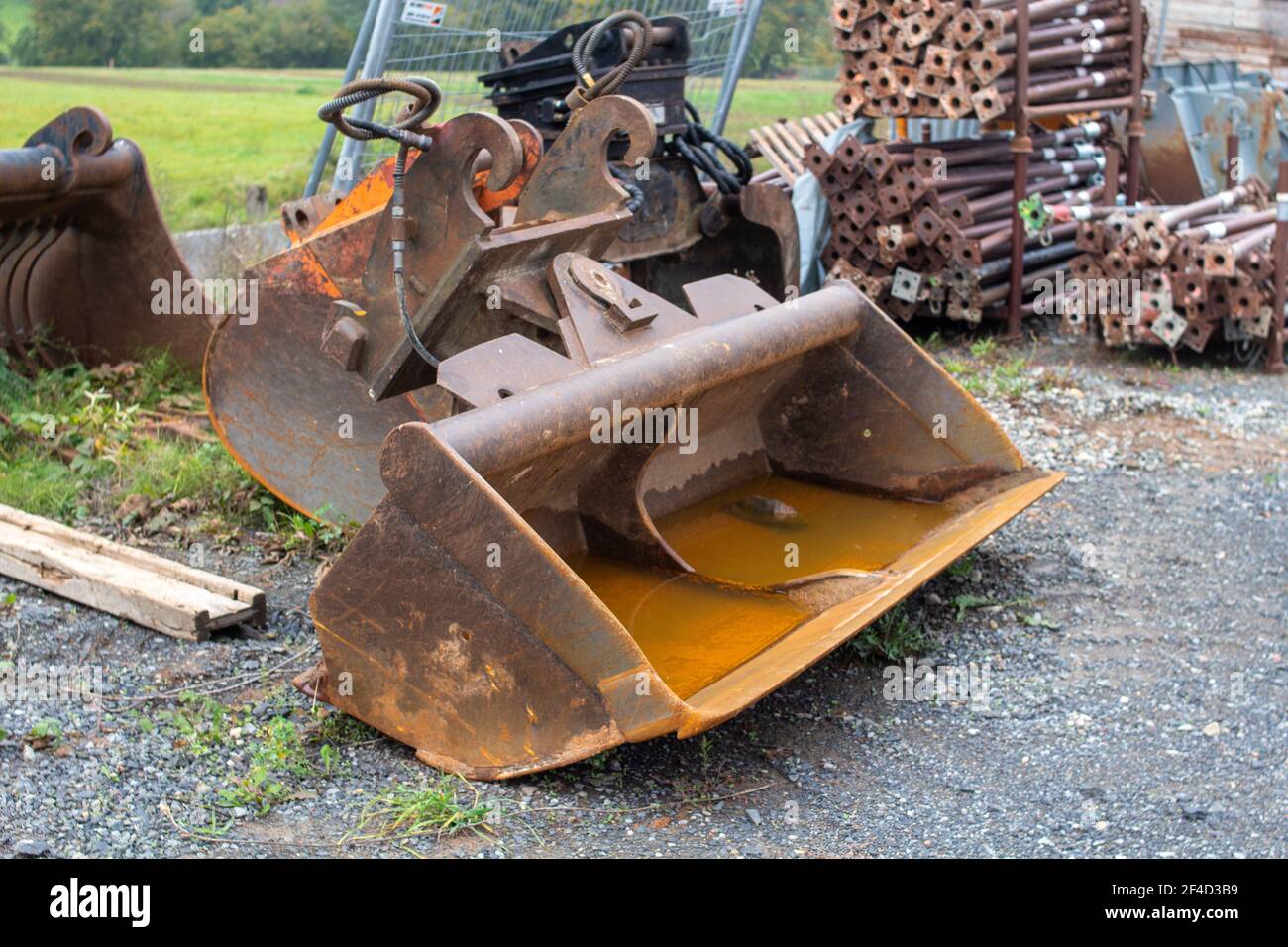A rusty ditch digging machine Stock Photo - Alamy