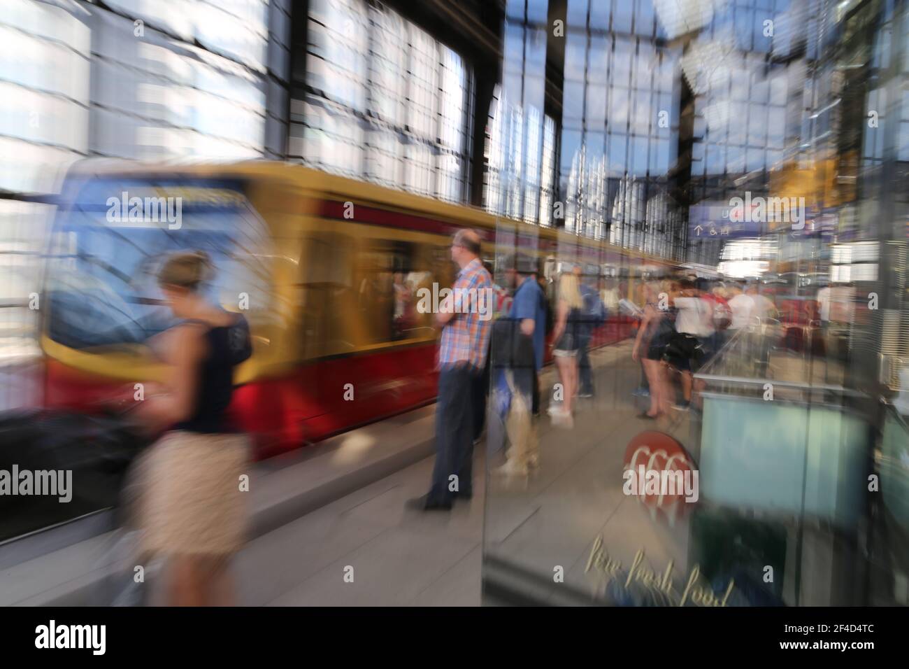 In coming train at train station Stock Photo - Alamy