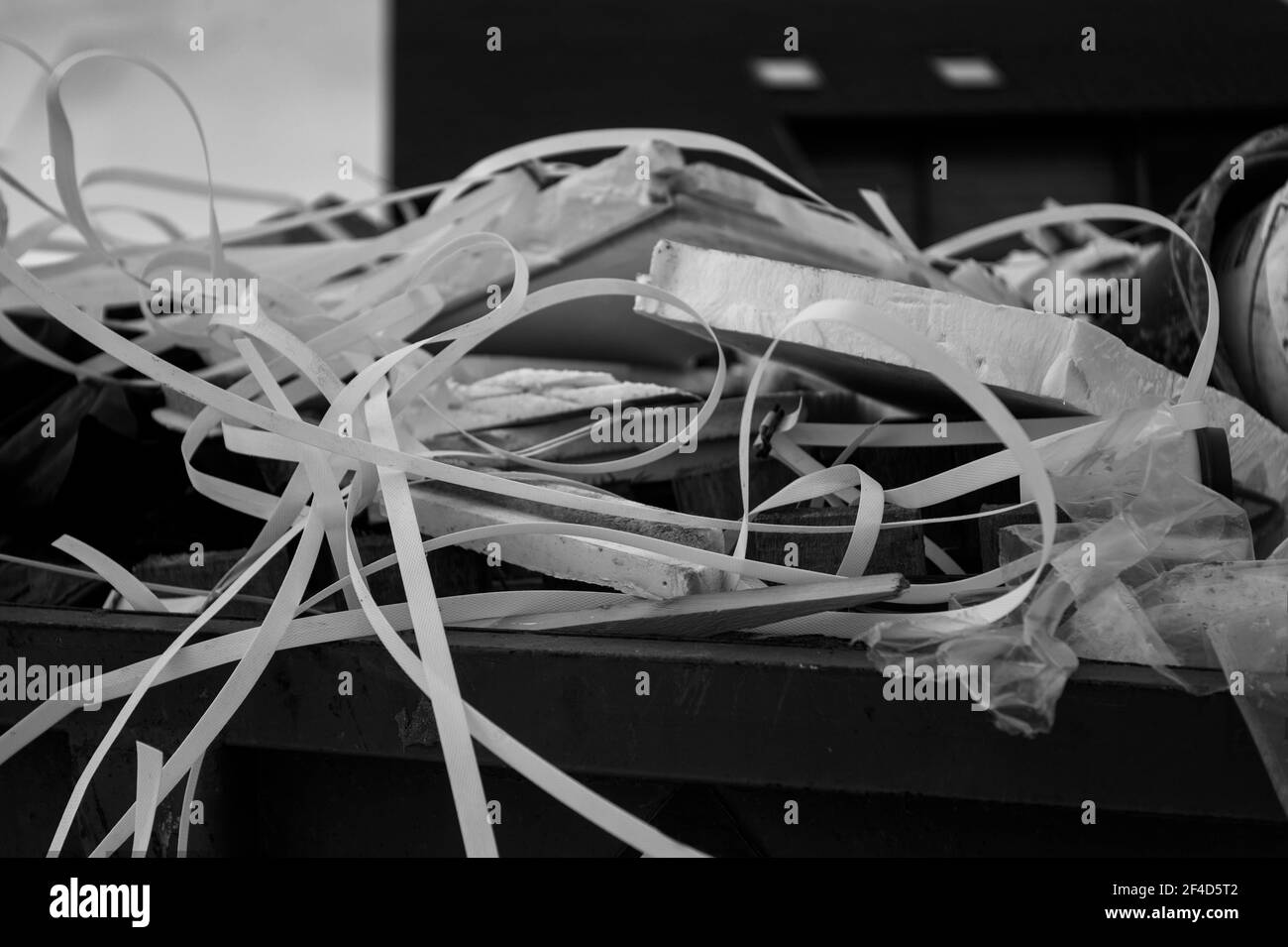 A container full of construction trash, in black and white Stock Photo ...