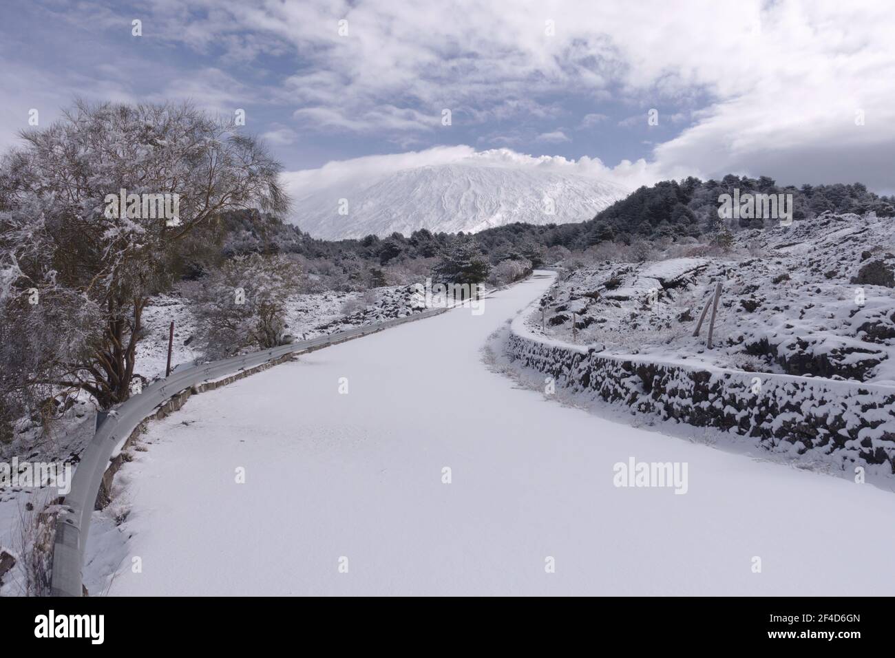 winter landscape of Sicily nature snow covered road mountain to Etna ...