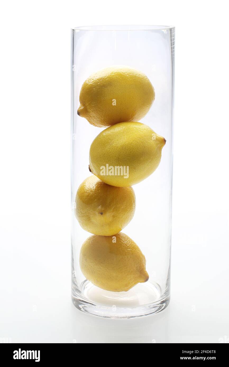 Stack of Lemons in Glass Stock Photo - Alamy