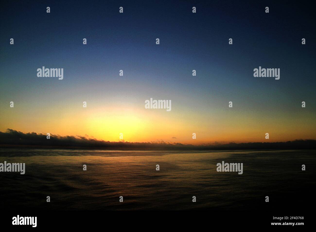 sunrise over ocean Stock Photo - Alamy