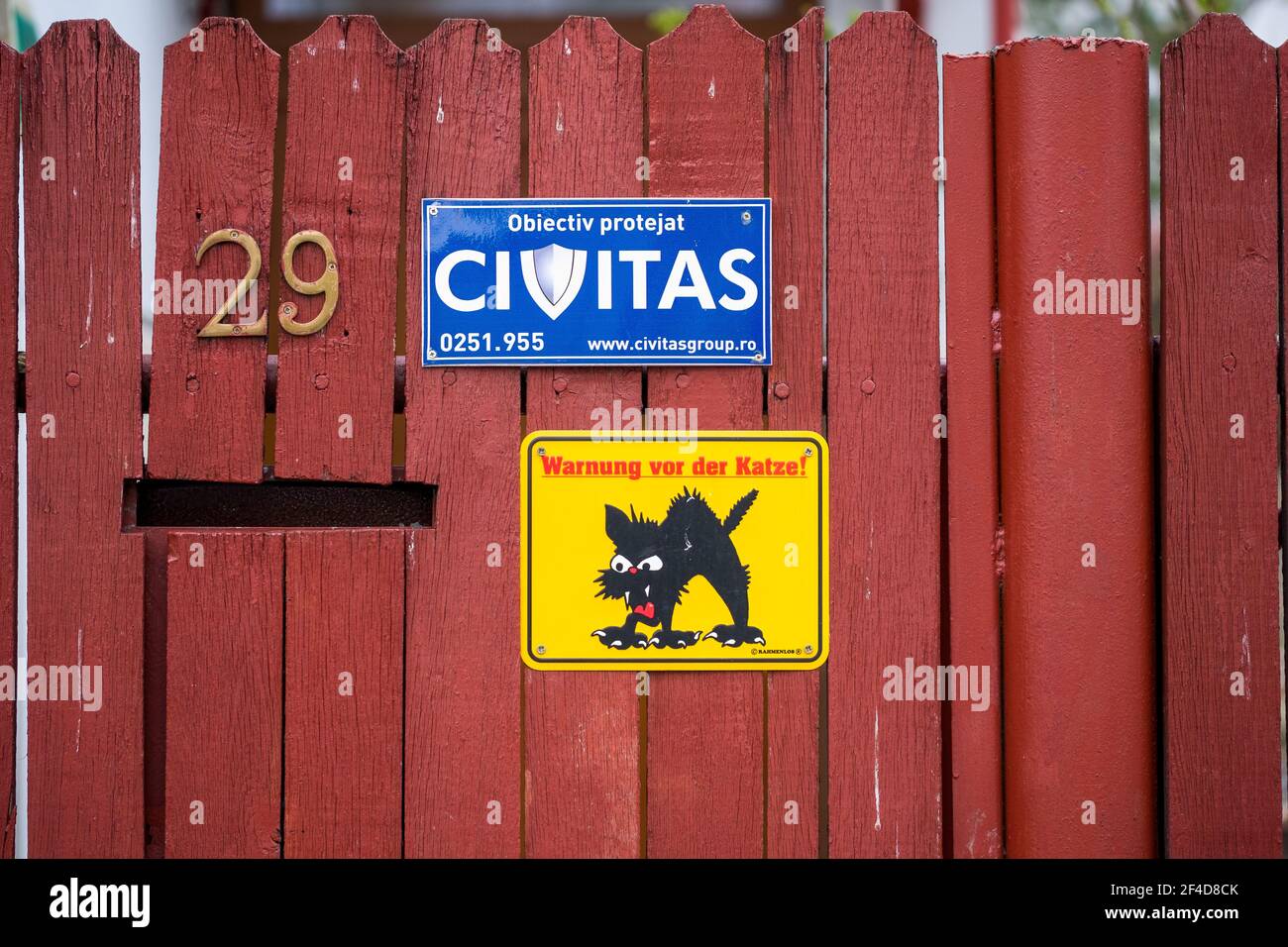 Warning sign of an entrance yard gate of a wild cat bite, Craiova ...
