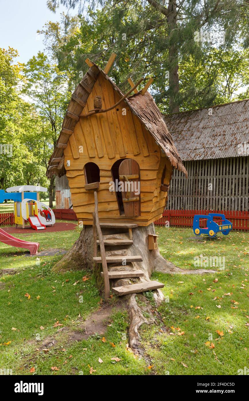 Children playground wooden hut, sunny summer day Stock Photo - Alamy
