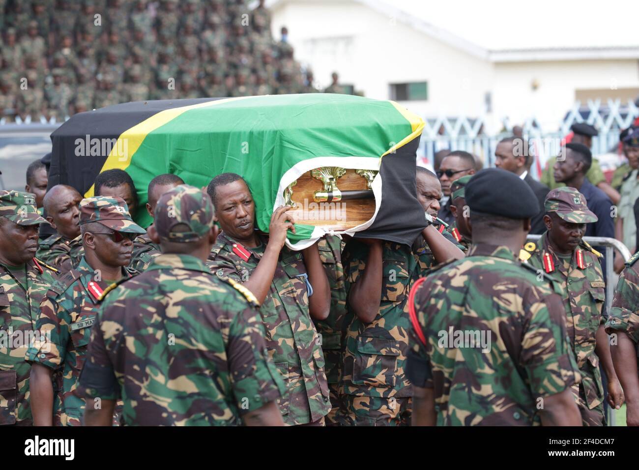 Dar Es Salaam, Tanzania. 20th Mar, 2021. Soldiers carry the casket of ...