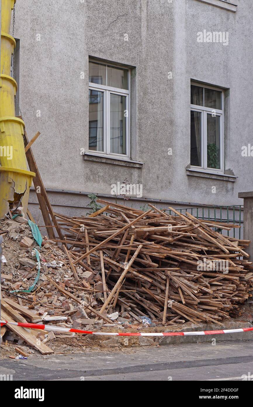 Construction trash chute and big bunch of waste Stock Photo - Alamy