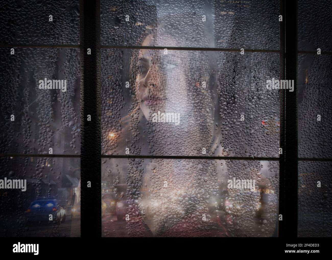 Woman looking through window rain hi-res stock photography and images ...