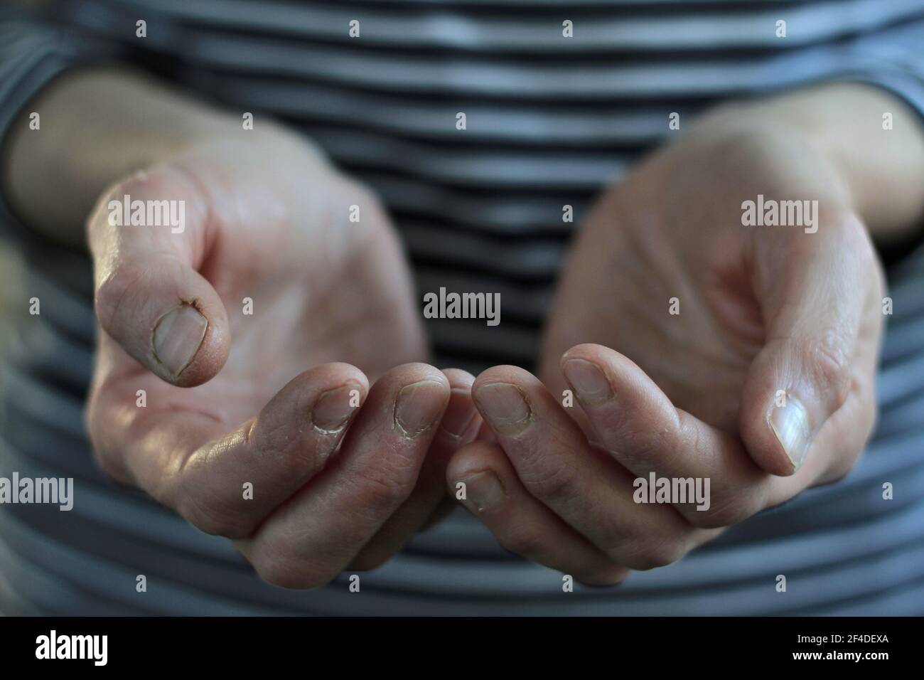 woman praying hands together on grey background stock photo Stock Photo ...