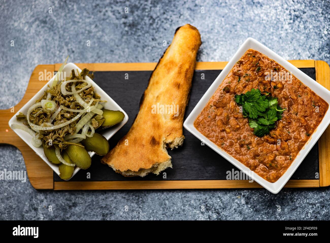 Traditional Georgian lobio dish with pickled jonjoli sprouts and tonis ...