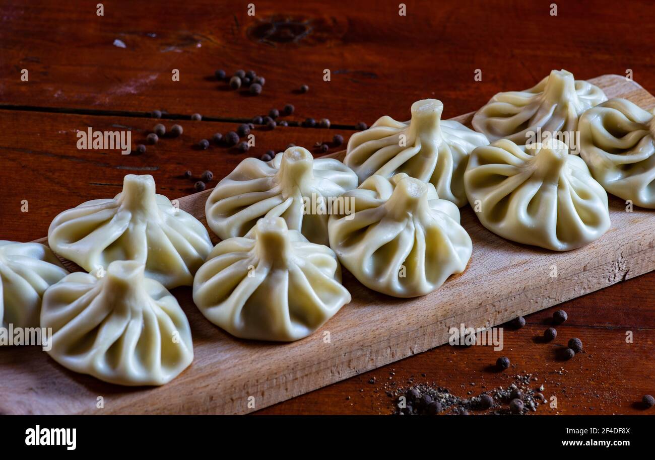 Traditional Georgian khinkali dish with fresh pepper Stock Photo - Alamy