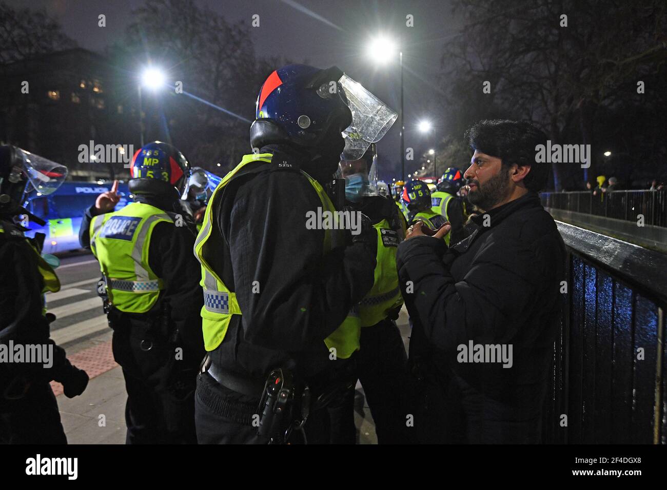 Police officers in riot helmets, at Hyde Park, central London, urged ...