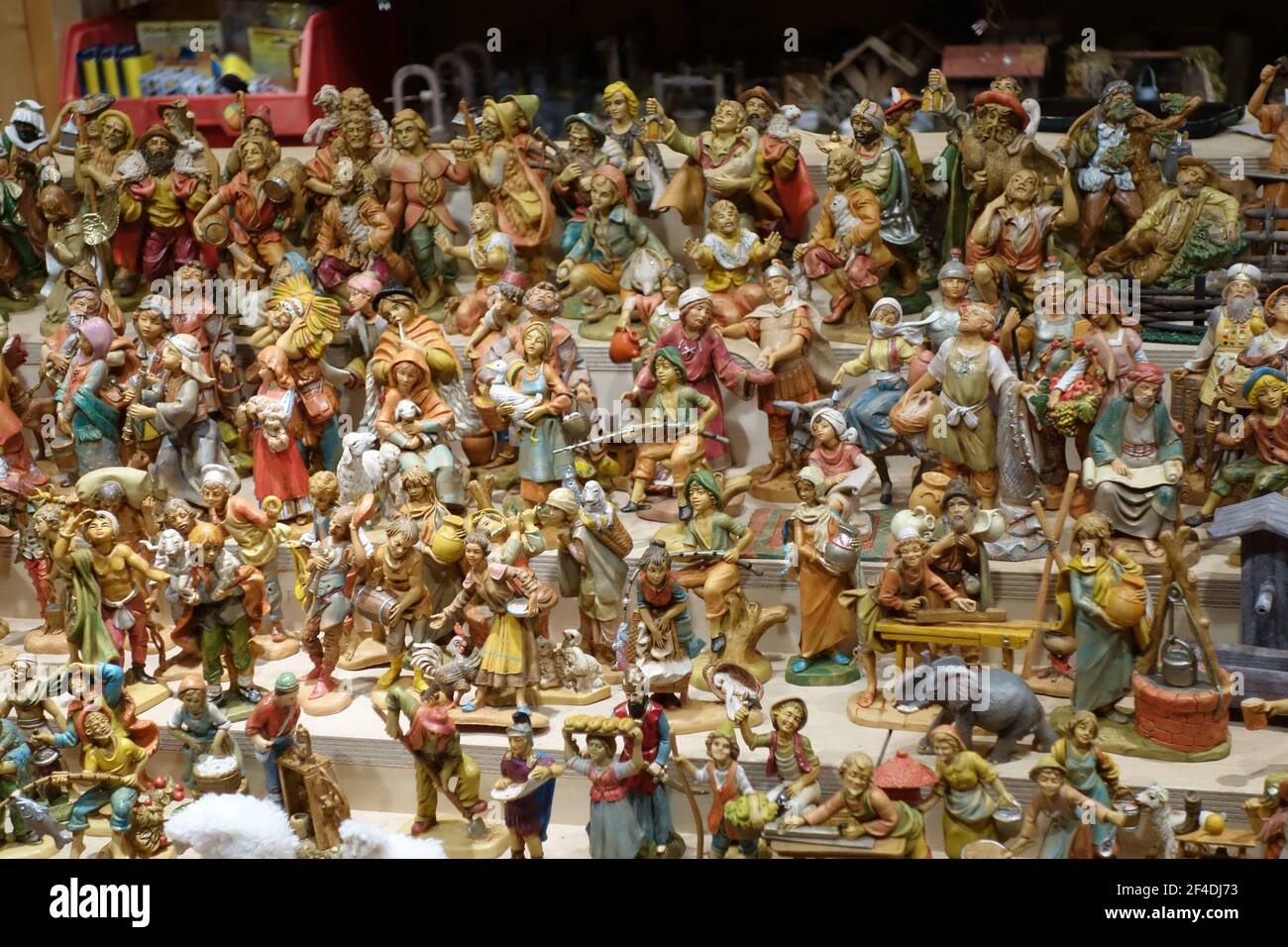 A closeup shot of traditional small statues of people in the market ...