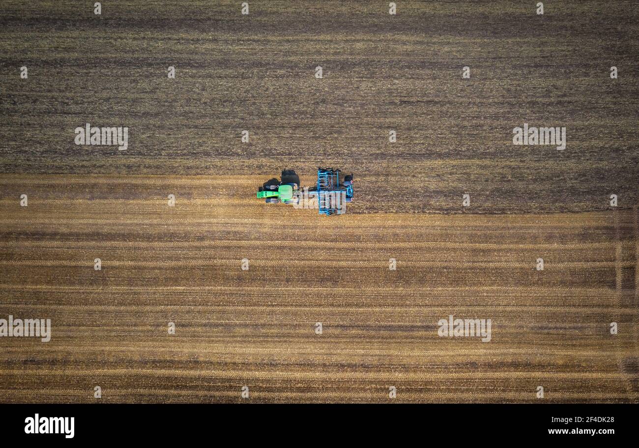 Aerial view of the tractor in the field, agricultural field work! Stock ...