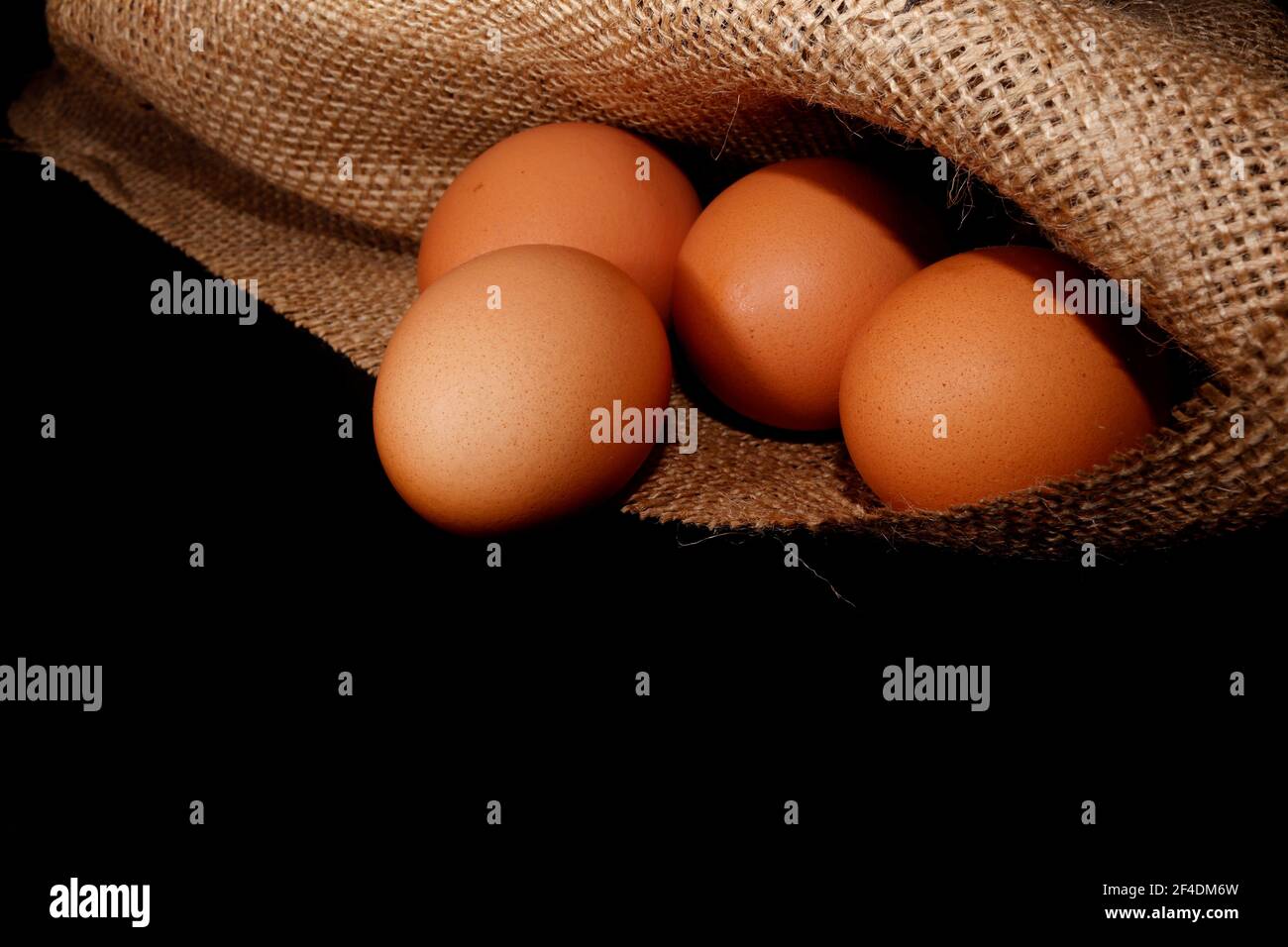 Fresh organic chicken eggs in burlap sack Stock Photo - Alamy