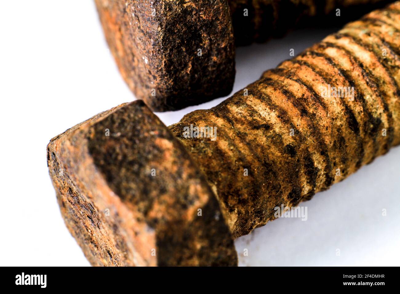 Macro photography of two rusty bolts on white background Stock Photo ...