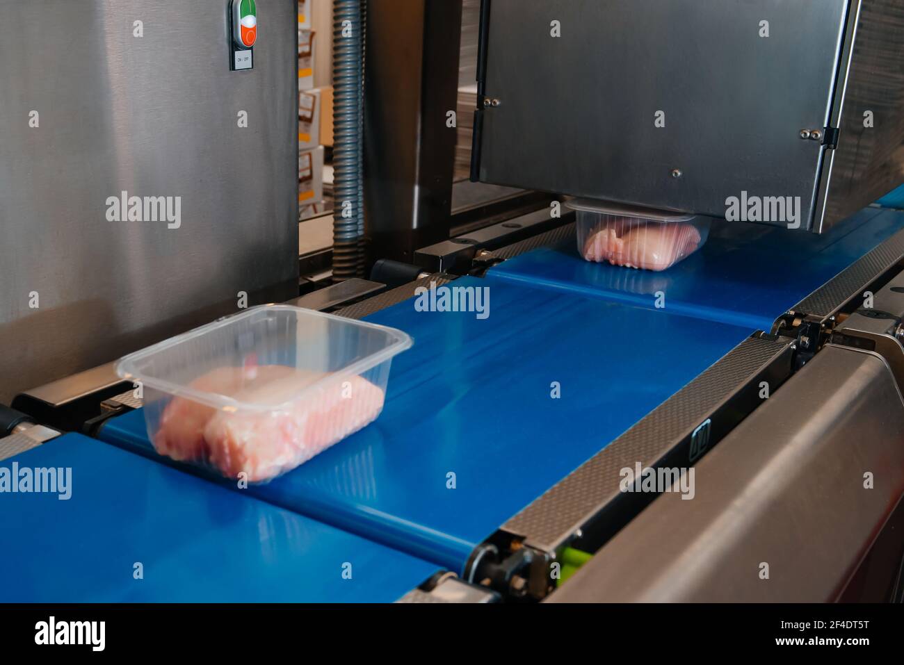 Production line with packaging and cutting of meat.Food products meat ...