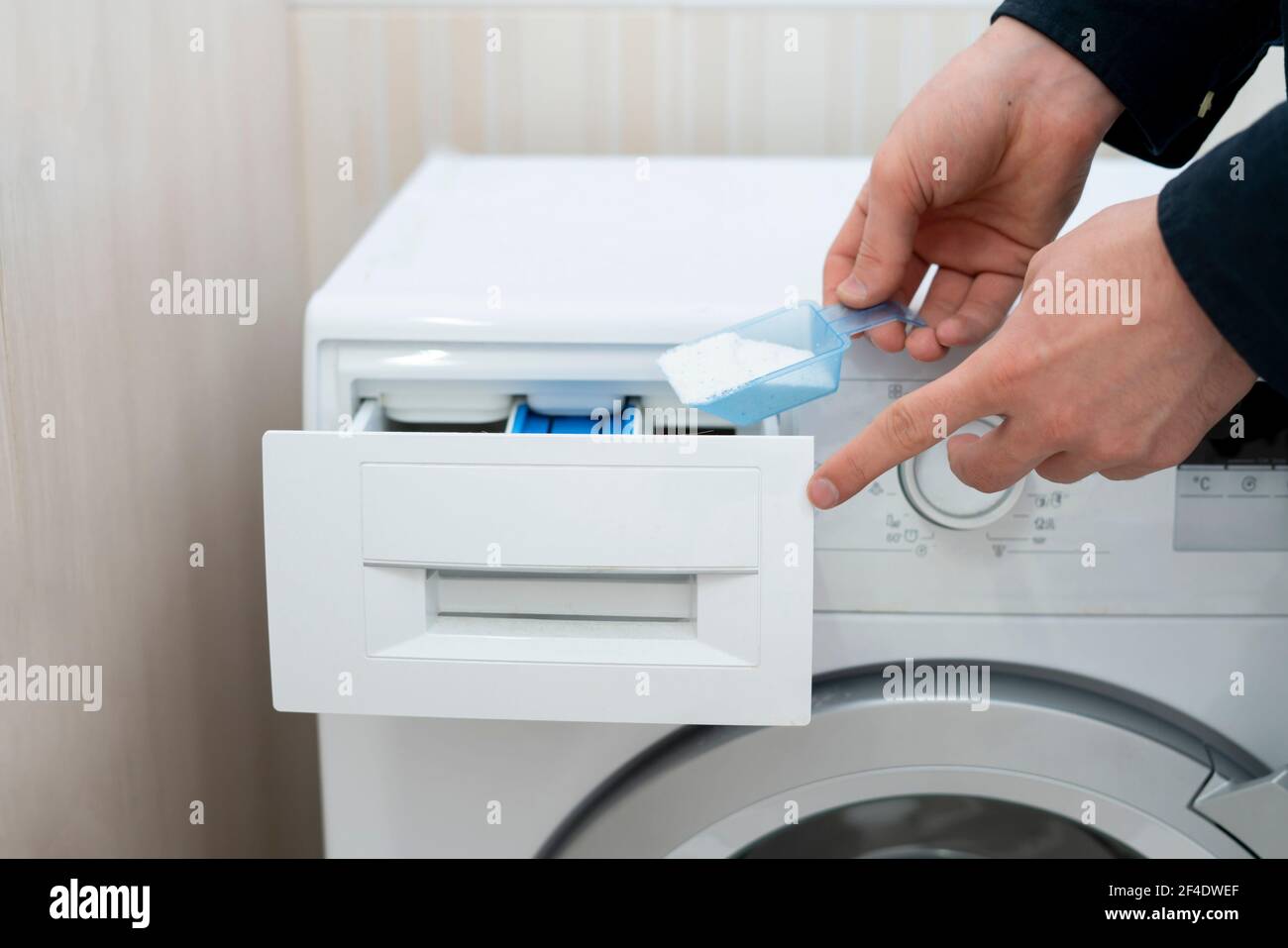 Woman powder washing machine hi-res stock photography and images - Alamy