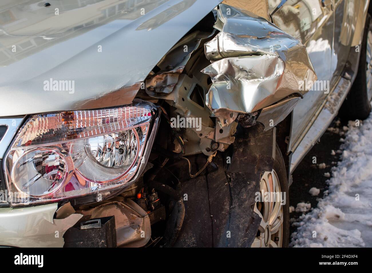 The front part of a damaged and crashed car after a traffic accident ...