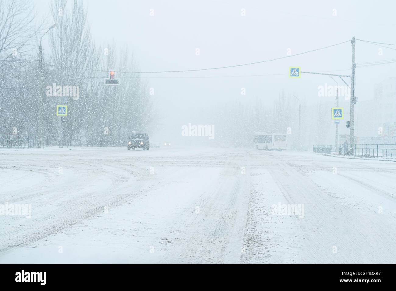 a dangerous stormy weather in the city, collapse, snowfall on highway ...