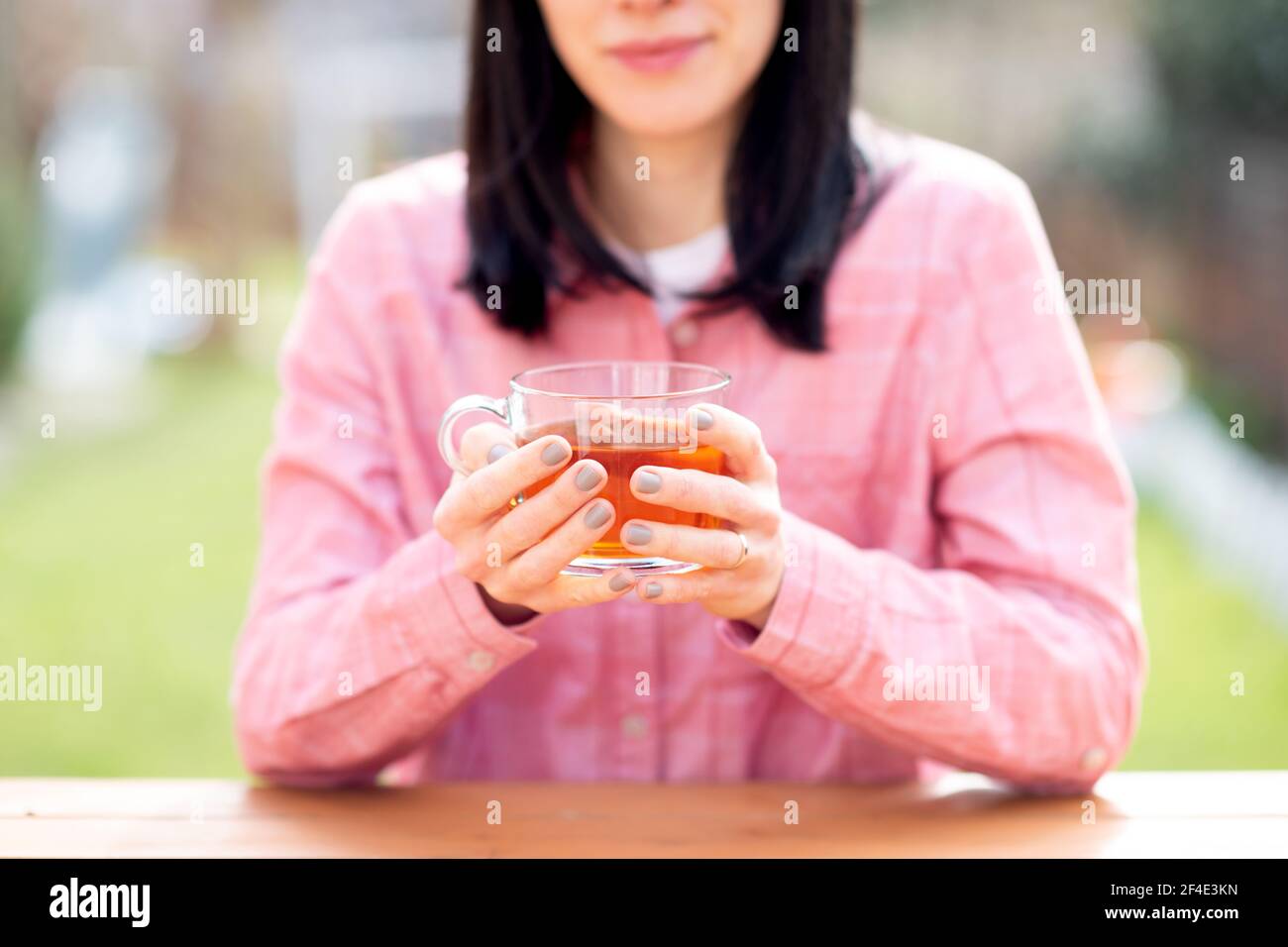Woman eating cake in garden hi-res stock photography and images - Alamy
