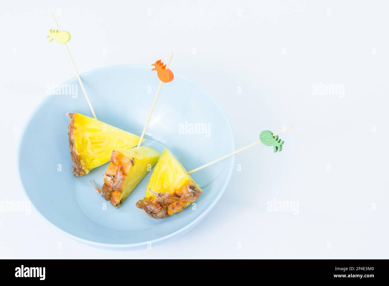 Pineapple skewers peeled and cut into triangles with chopsticks ...