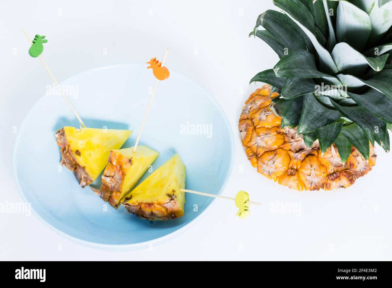 Pineapple skewers peeled and cut into triangles with chopsticks ...