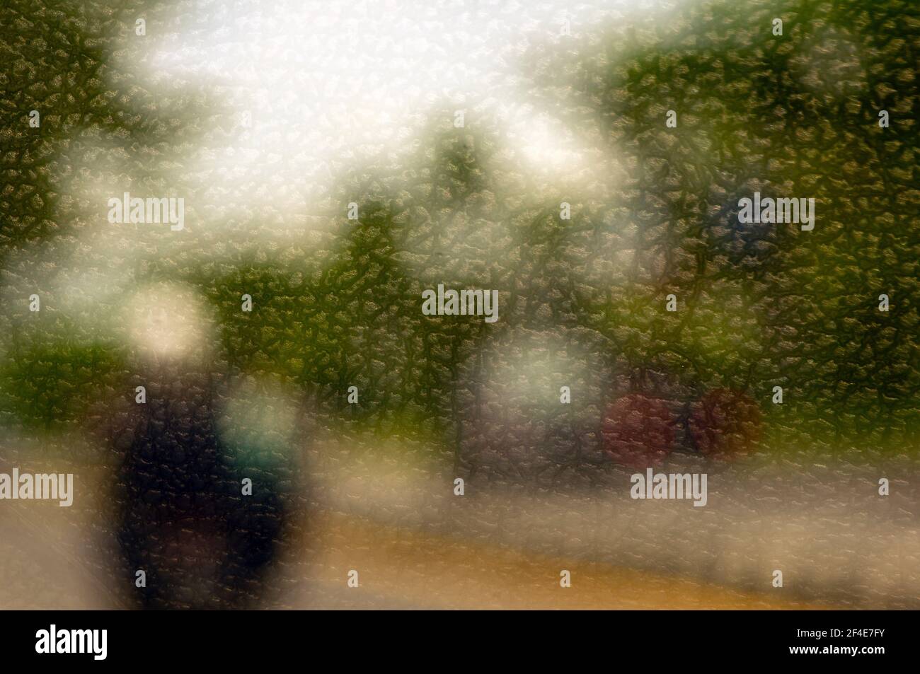 Defocused abstract background of a view behind a glass surface with ...