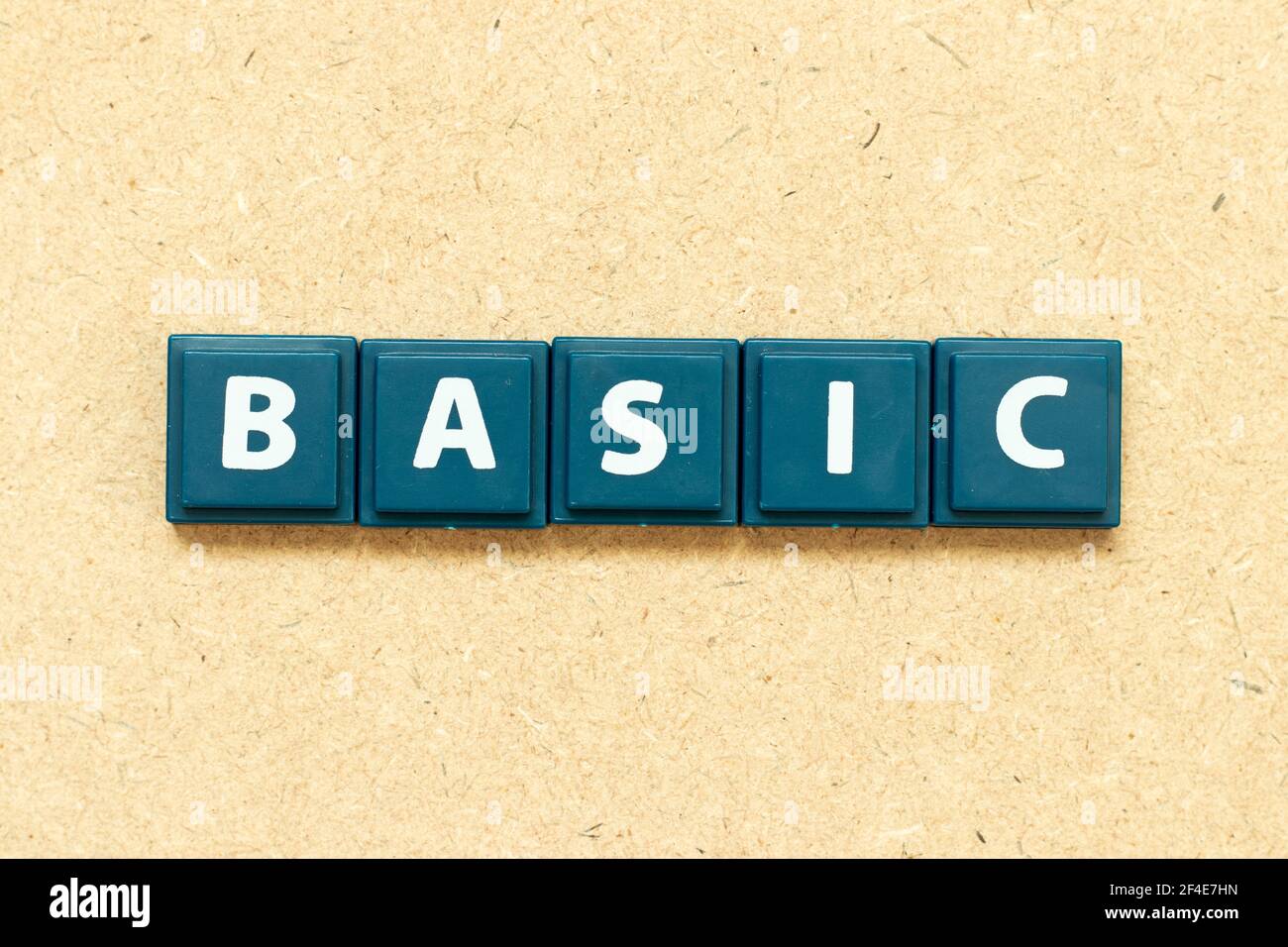 Tile alphabet letter in word basic on wood background Stock Photo - Alamy