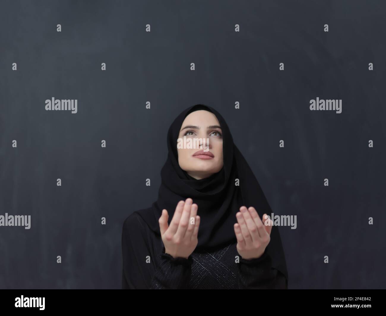 Portrait of young Muslim woman making dua Stock Photo - Alamy