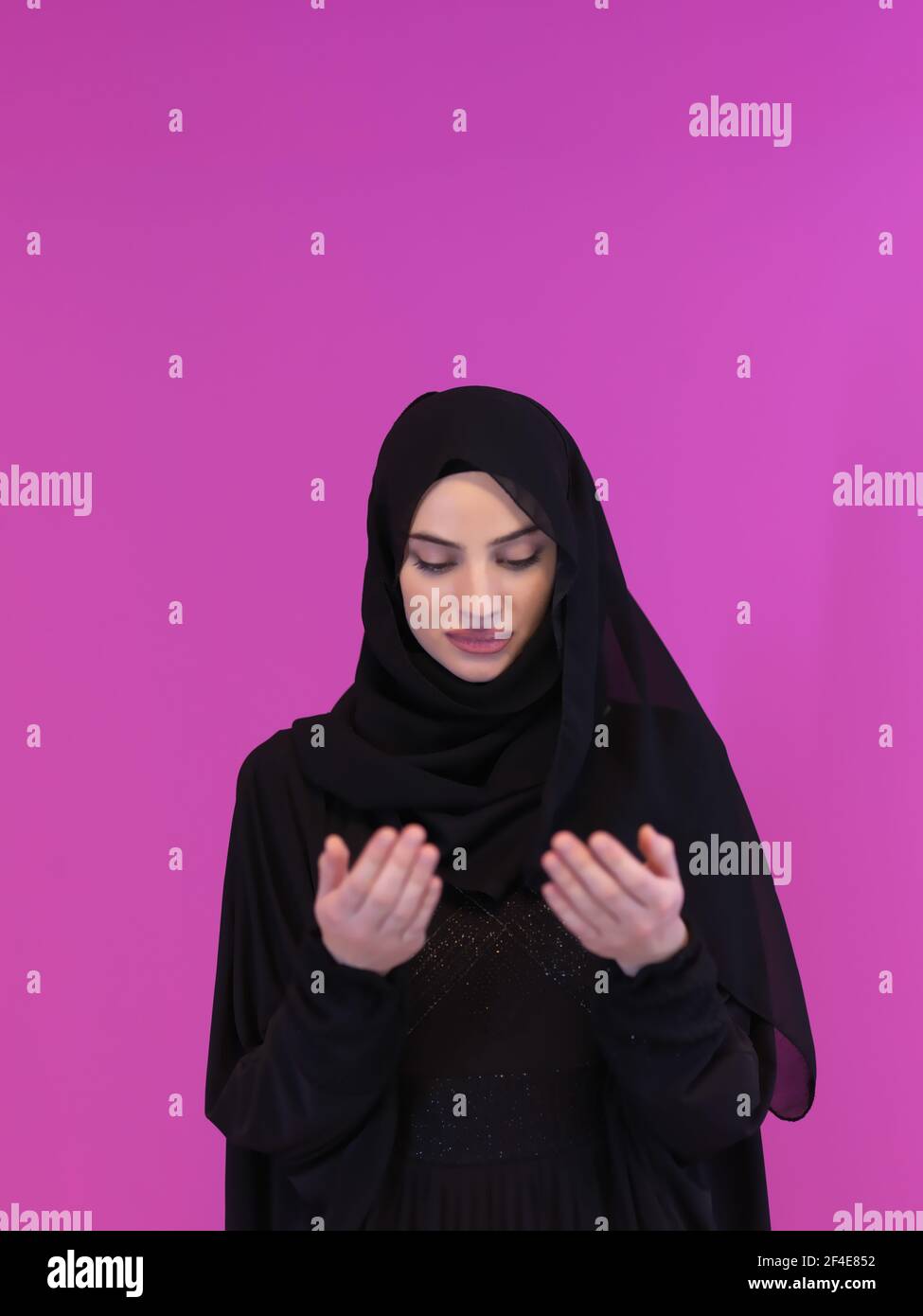 Portrait of young Muslim woman making dua Stock Photo - Alamy