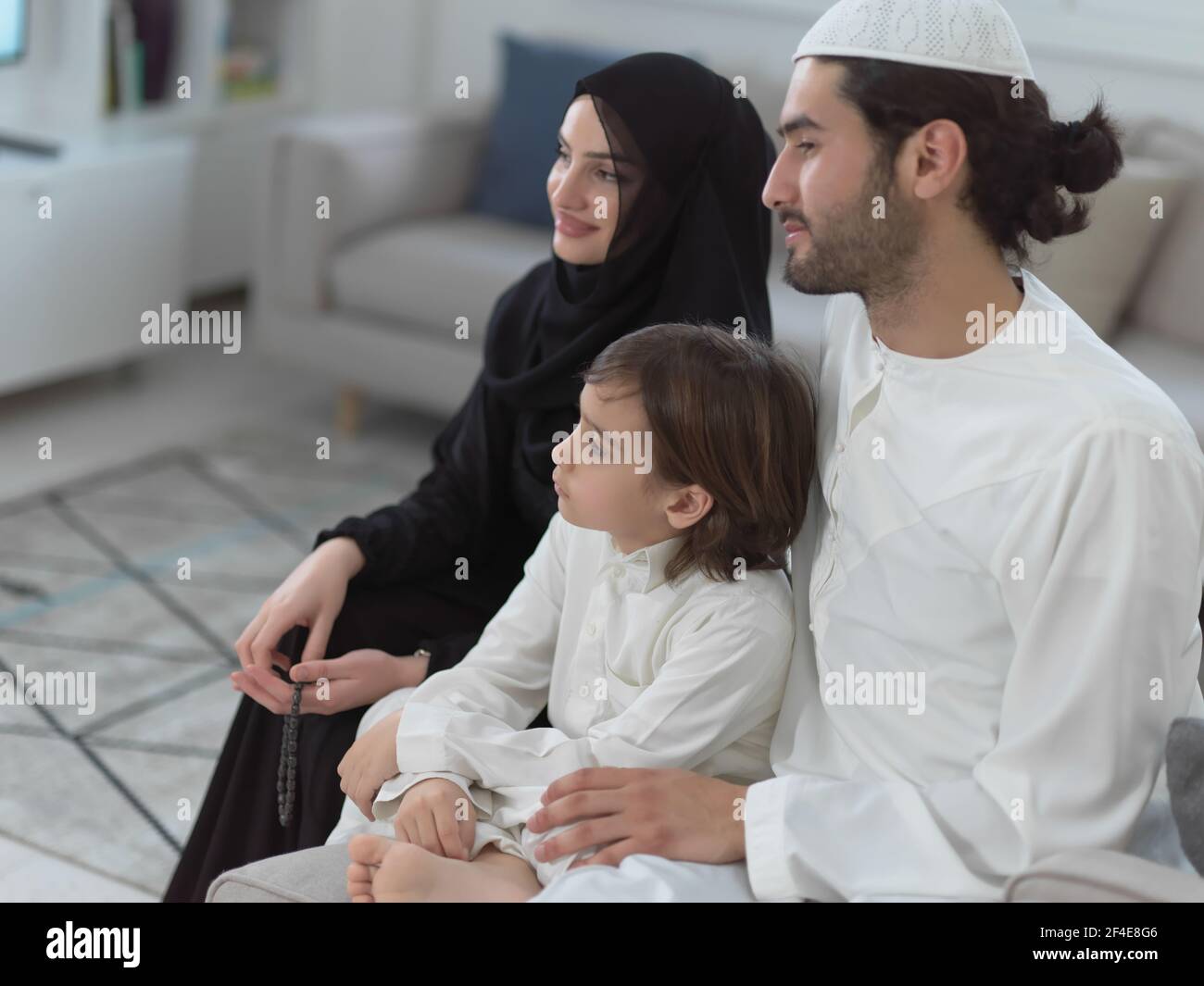 Top view of young arabian muslim family wearing traditional clothes ...